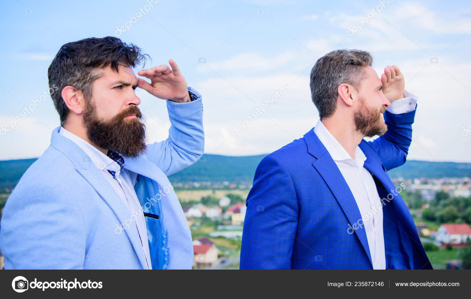 Developing business direction. Men formal suit managers looking at ...