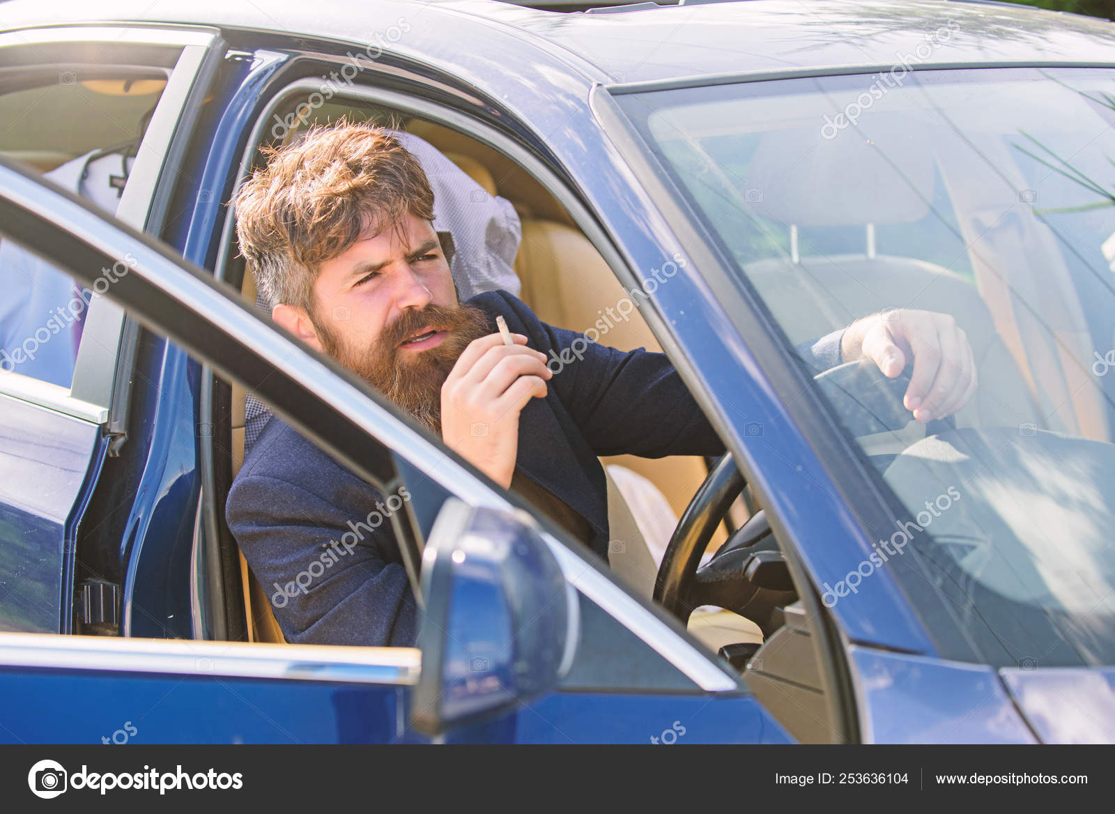 Driver smoking cigarette. Minute to relax. Businessman tired after hard ...