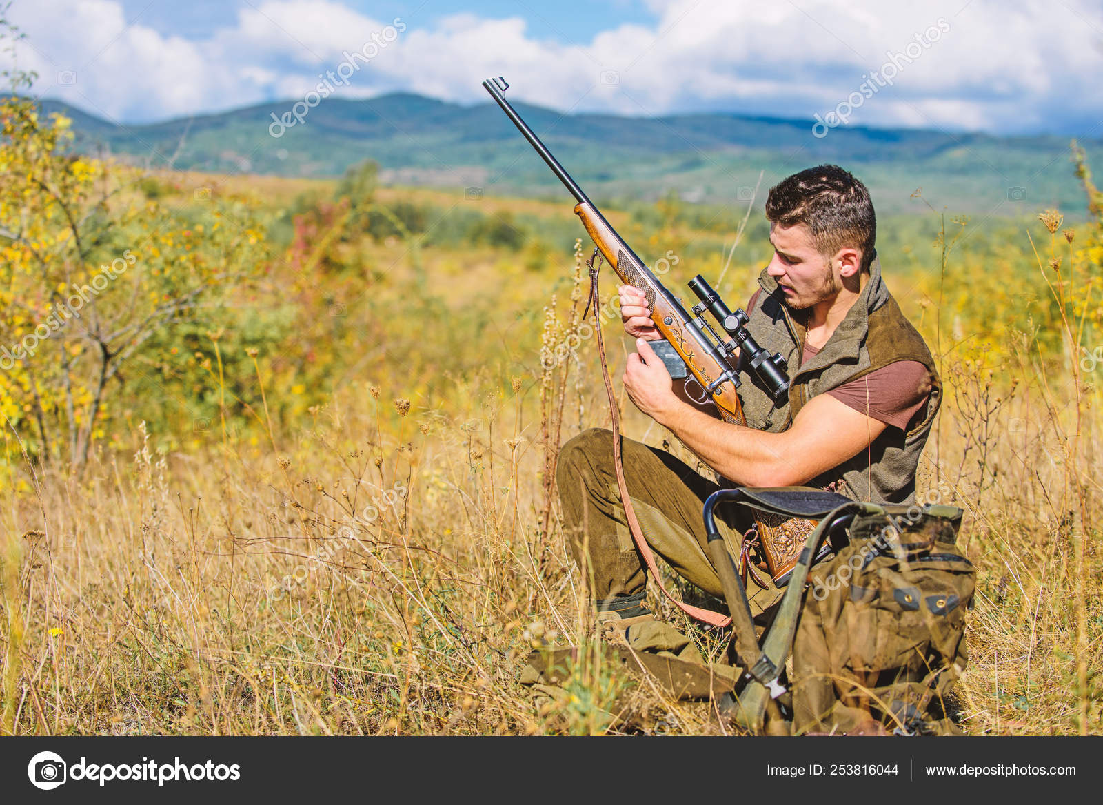 Hunter with rifle looking for animal. Hunting hobby and leisure. Man ...