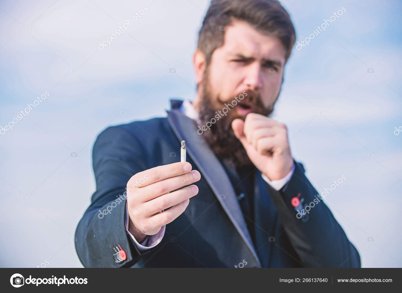 Guy cigarette enjoy nicotine influence. Man with beard mustache hold ...