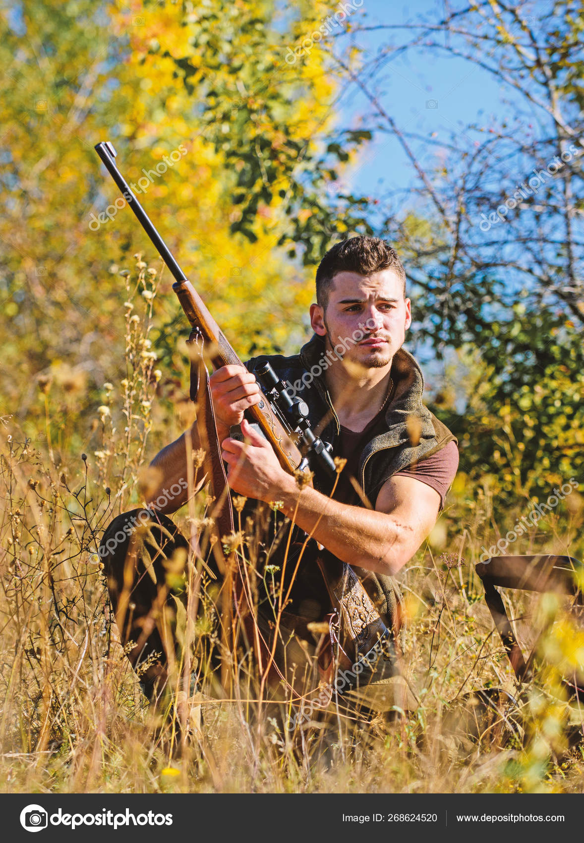 Hunter with rifle ready to hunting nature background. Hunting skills ...