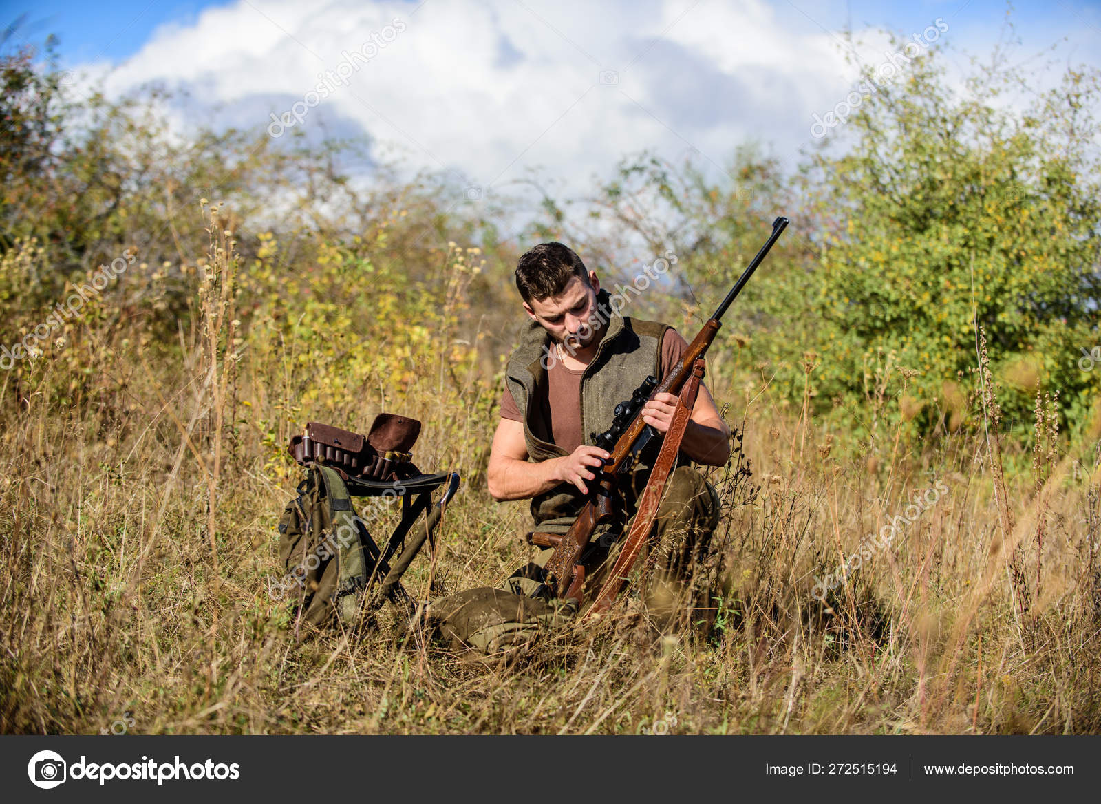 Man with rifle hunting equipment nature background. Recharge rifle ...