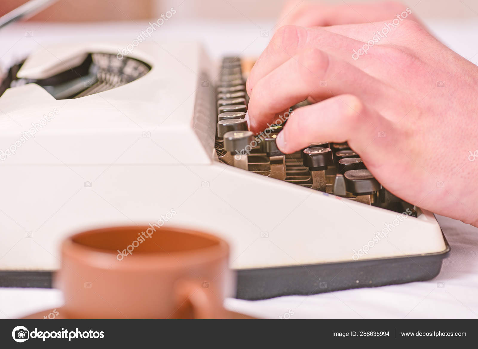 Hands typing retro writing machine. Old typewriter and authors hands. Male hands type story or ...