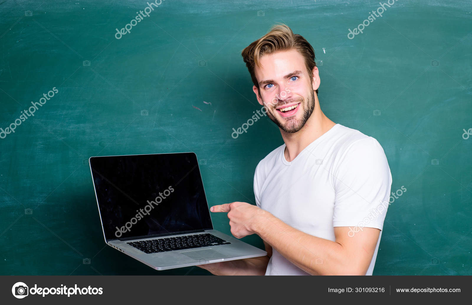 School teacher programming with laptop. Handsome man use modern ... School teacher programming with laptop. Handsome man use modern ...