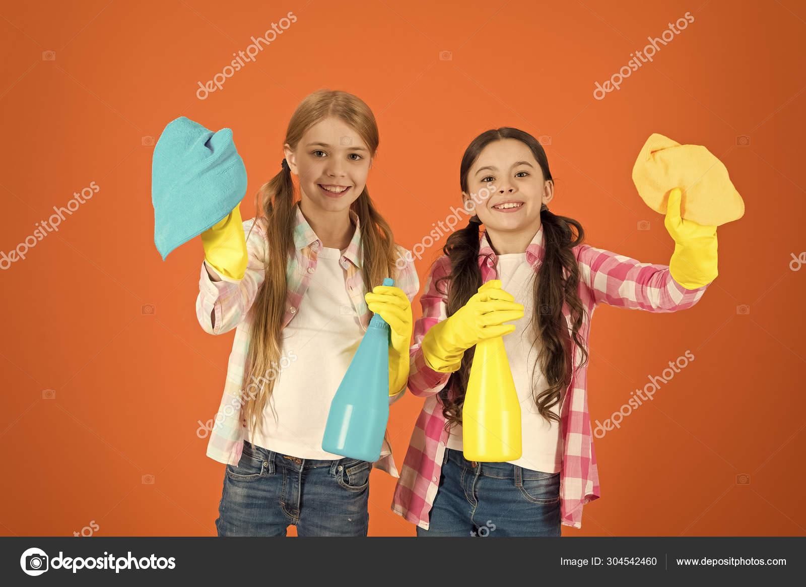 Kids cleaning together. Nice and tidy. Girls with mist spray and rag ...