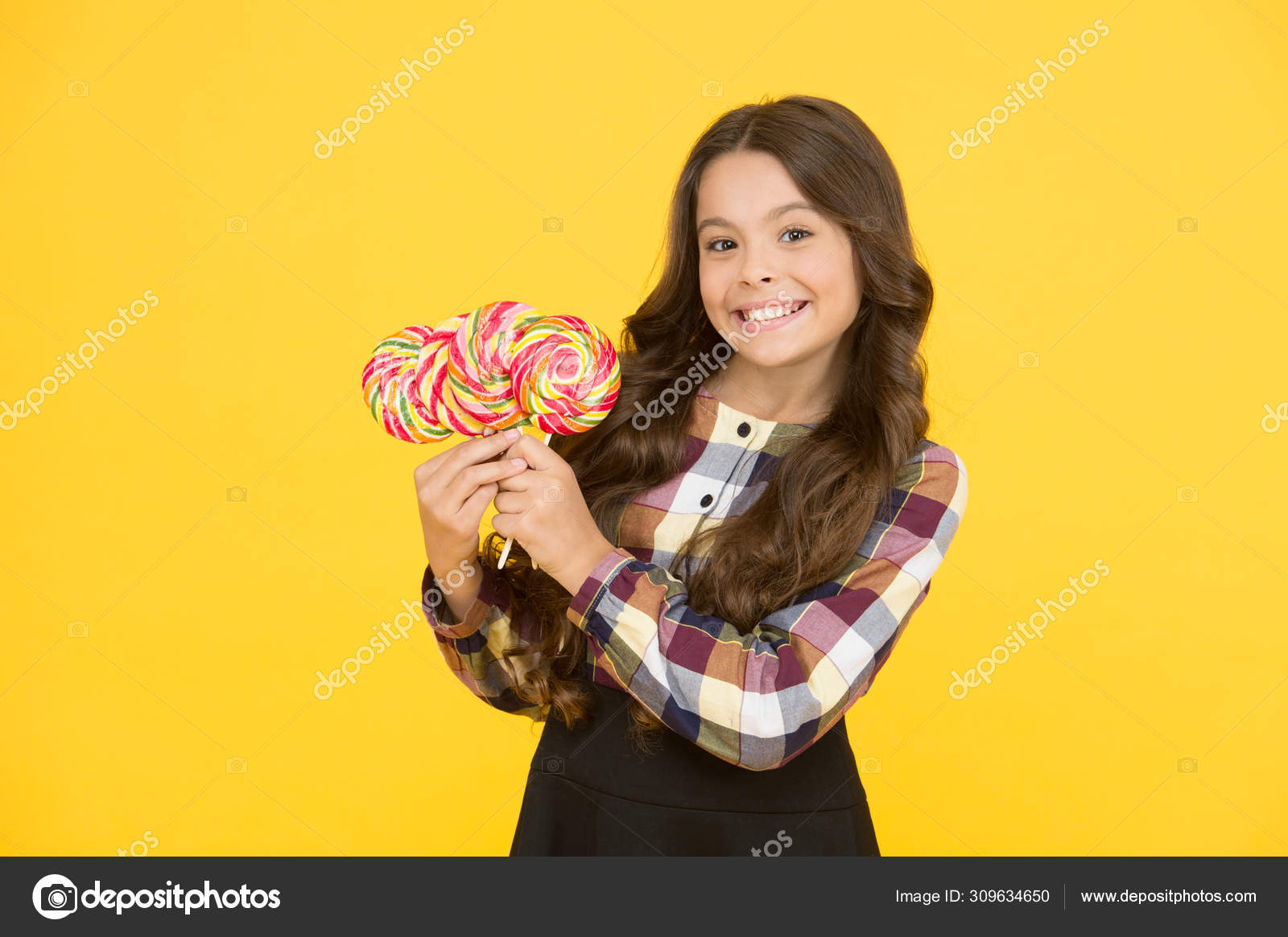 Sugar addiction. Happy kid with sweet candy. Kid child holding ...