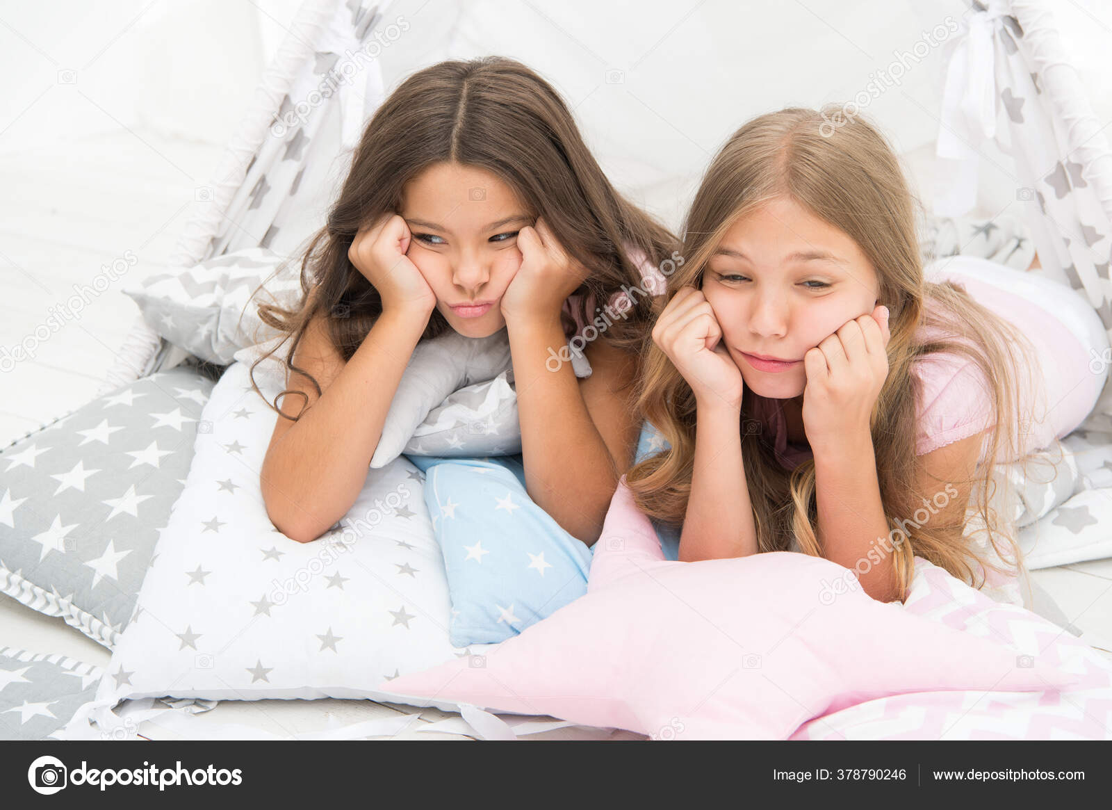 Bored kids on quarantine. Sisters best friends spend time together lay ...