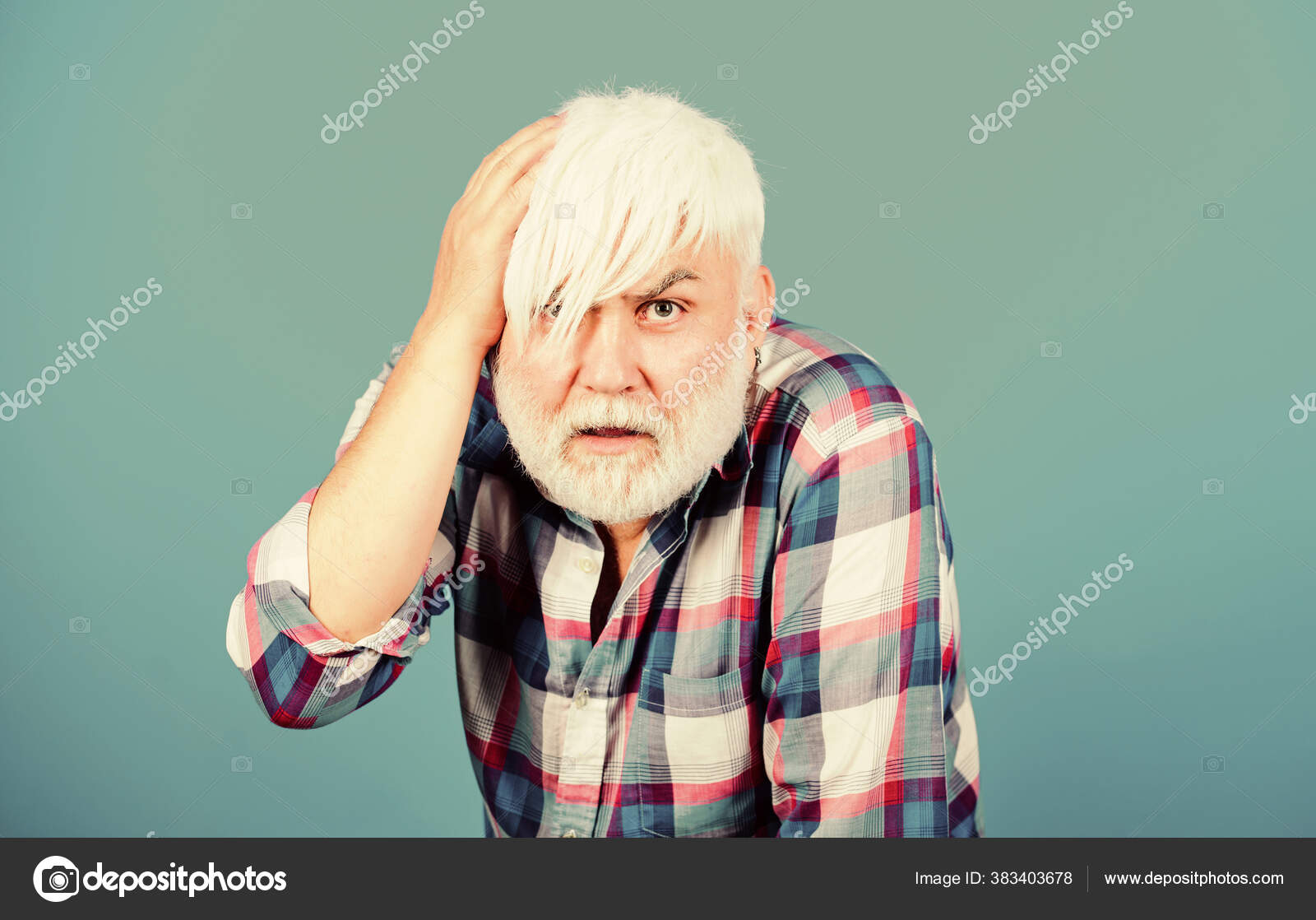 Senior emotional man with long bangs and beard. Subculture and ...