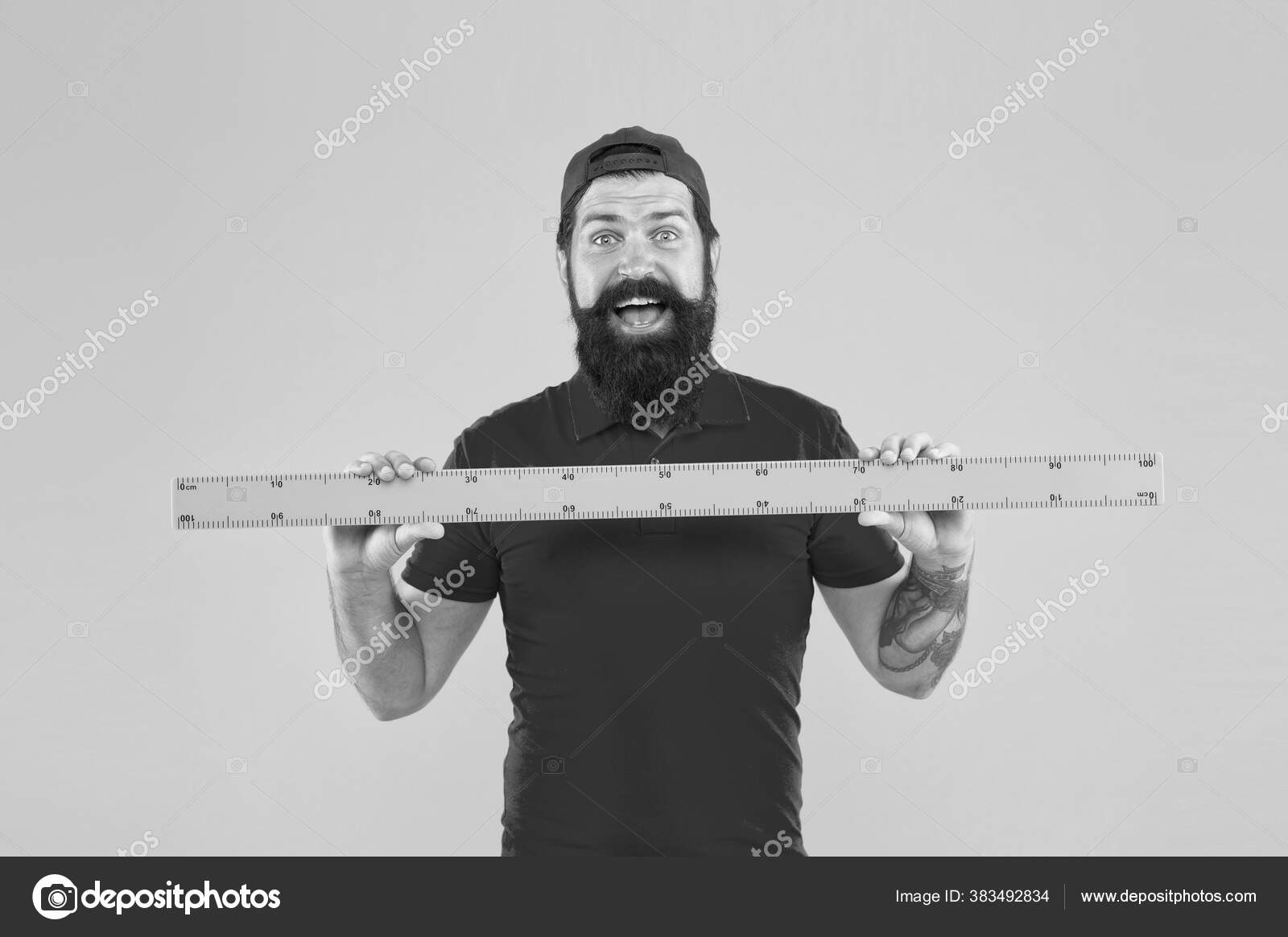 Perfect size. Bearded man with big measuring instrument. Measuring with ...