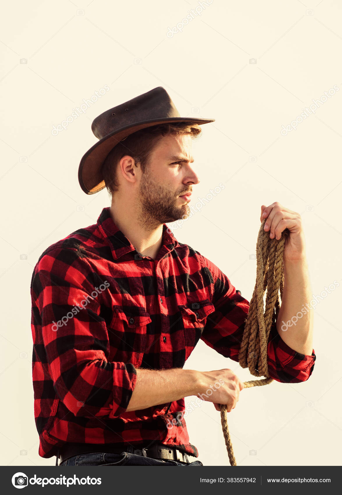 Farming concept. Handsome man in hat and rustic style outfit. Keep ...