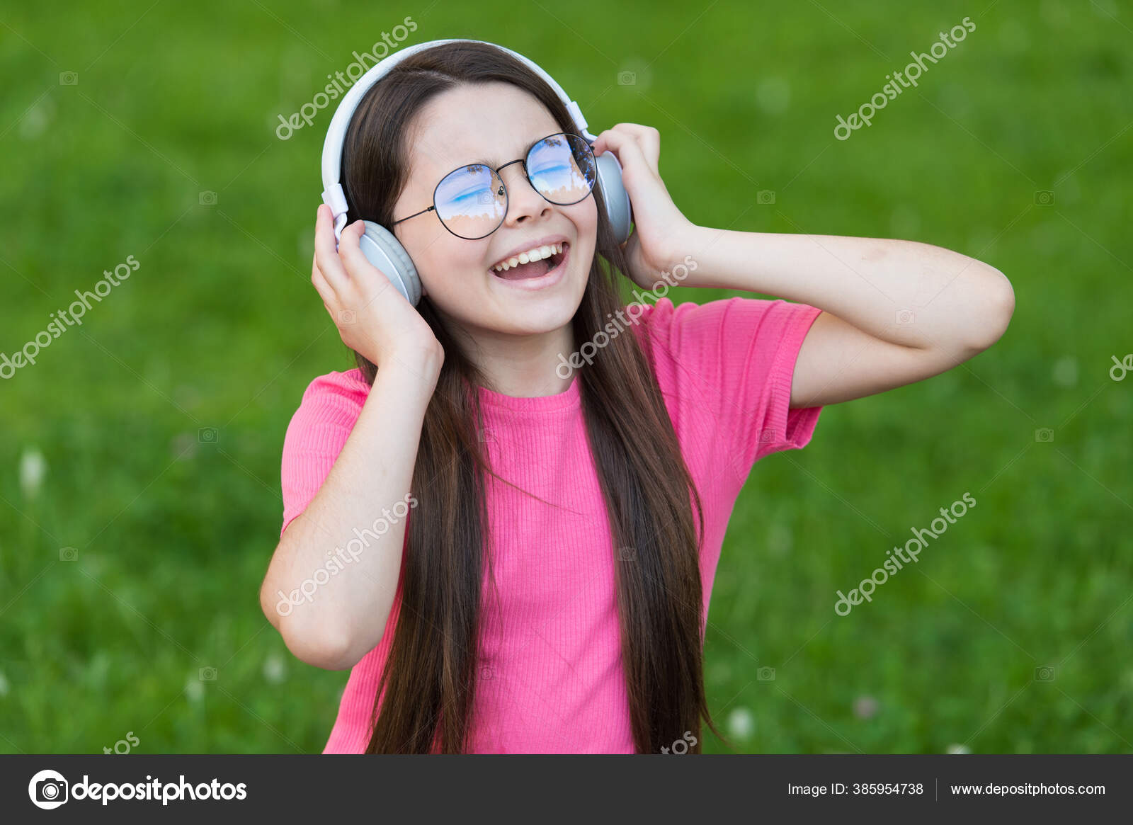 Adding happiness through singing. Happy singer sing song on green grass ...