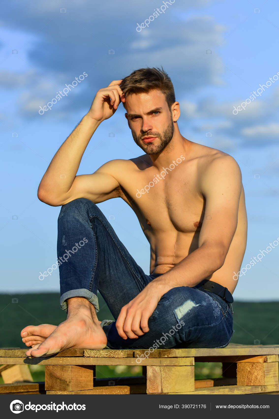 Fitness model. Athletic handsome macho wear denim pants. Muscular body ...