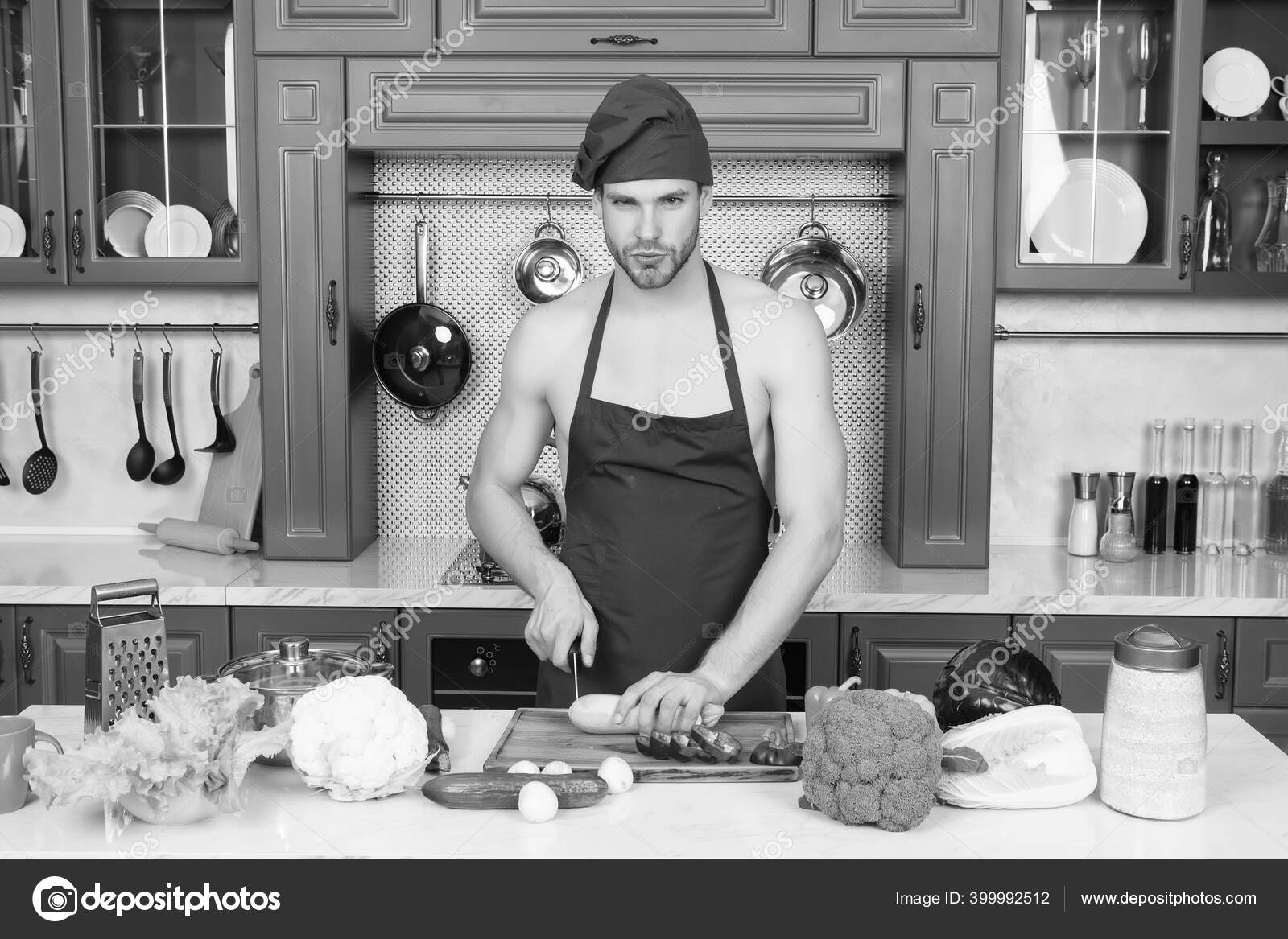 Sexy macho wear cook uniform. man in kitchen. good husband and ...