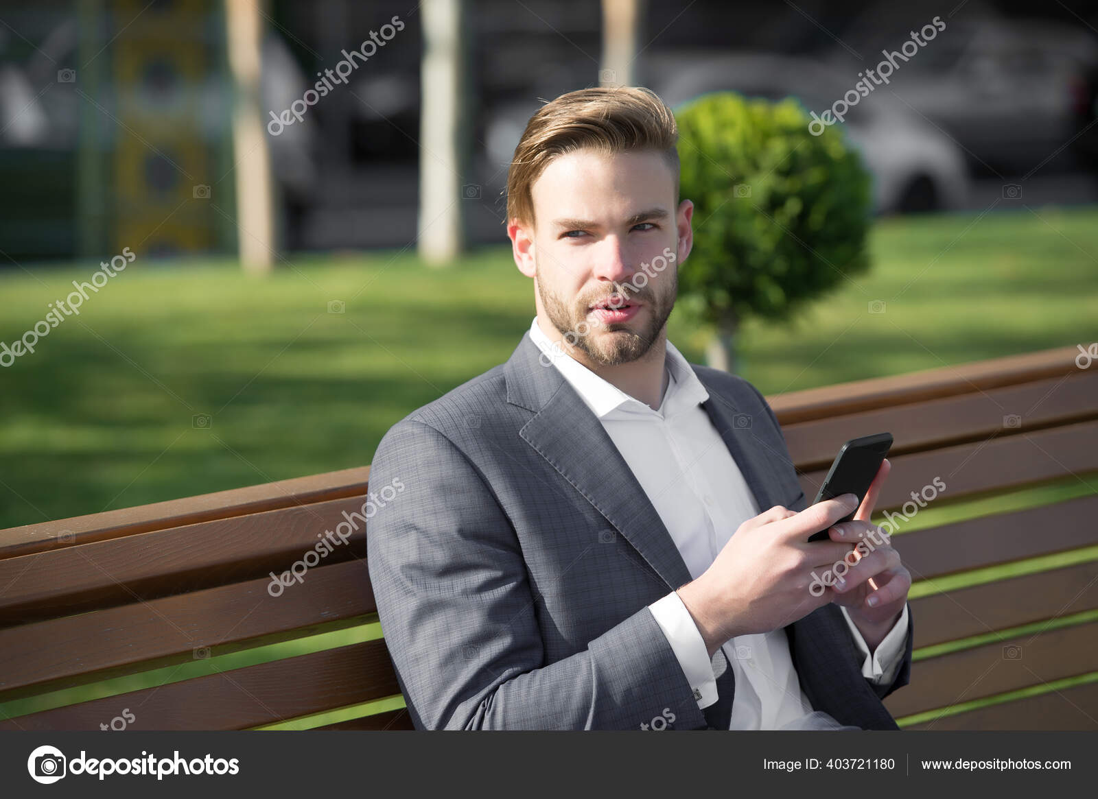 Message concept. Man types message mobile phone. Man in suit ...