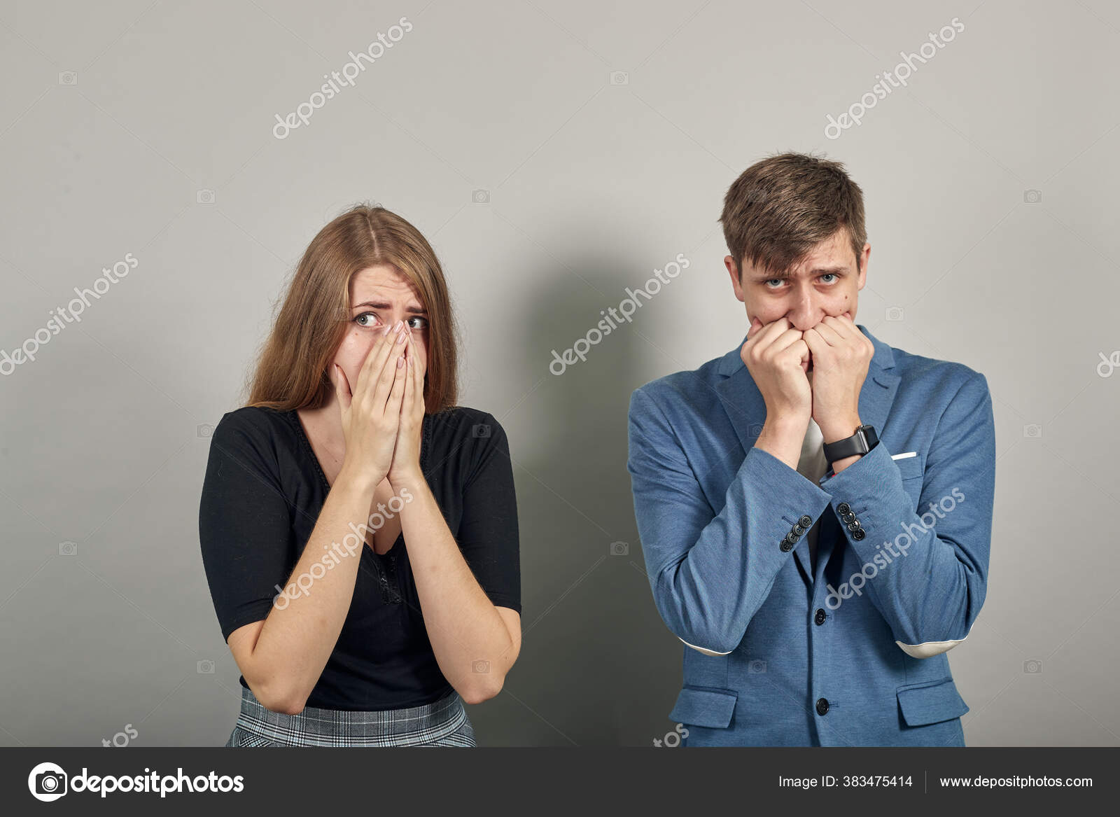 Scared, biting fists emotionally. Covering mouth behind knuckle. Having ...