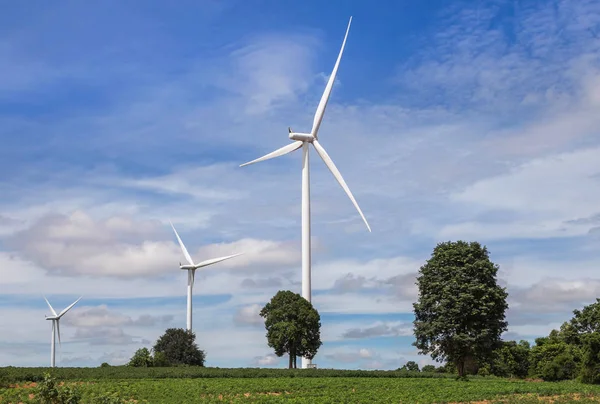 white wind turbines generating electricity in wind power station ...