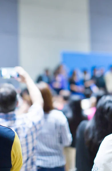 Conference with panel speakers on stage during debate. Presenters at ...