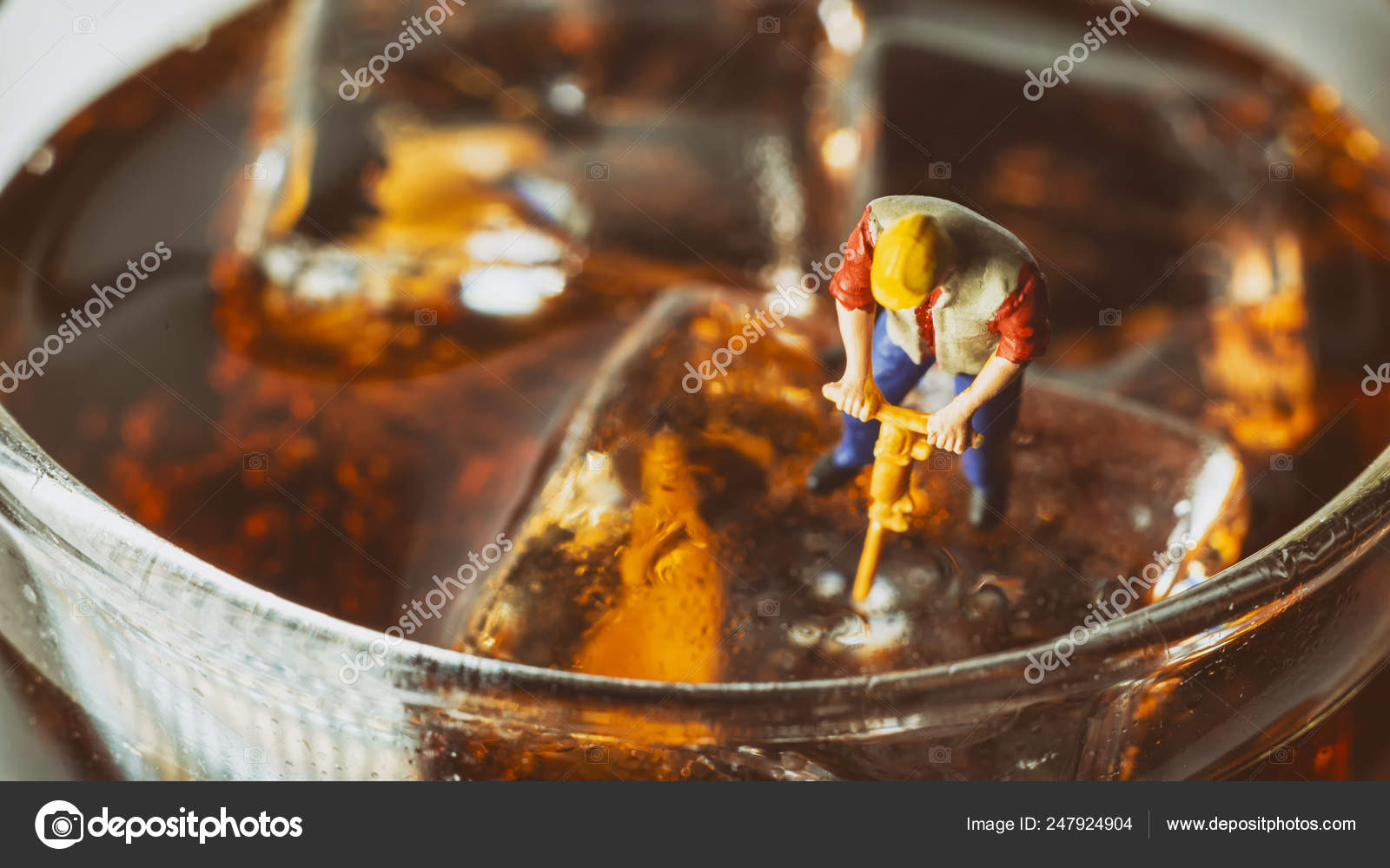Miniature Worker Drilling Ice Cold Drink Stock Photo by ©czgur 247924904