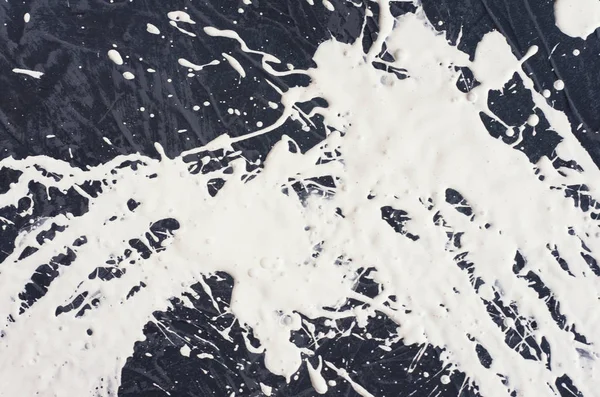 a spot of white spilled paint on a concrete textured surface. - Stock ...