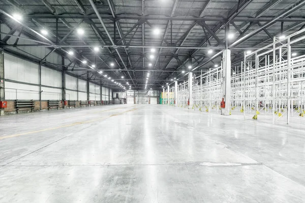Interior of empty warehouse with empty racks - Stock Image - Everypixel