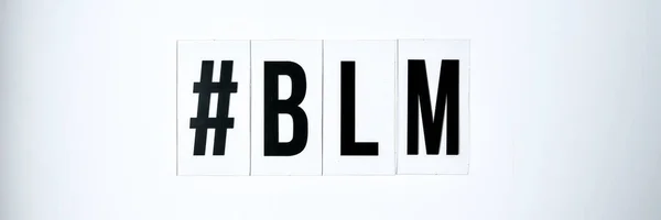 hashtag BLM BLACK LIVES MATTER text on a white background. Protest ...