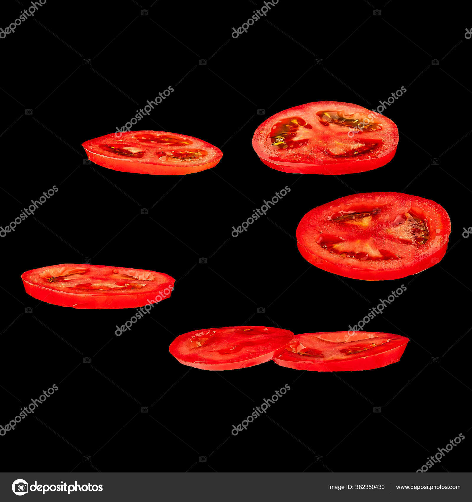 Flying tomato. Sliced red tomato isolated on black background. Levity ...