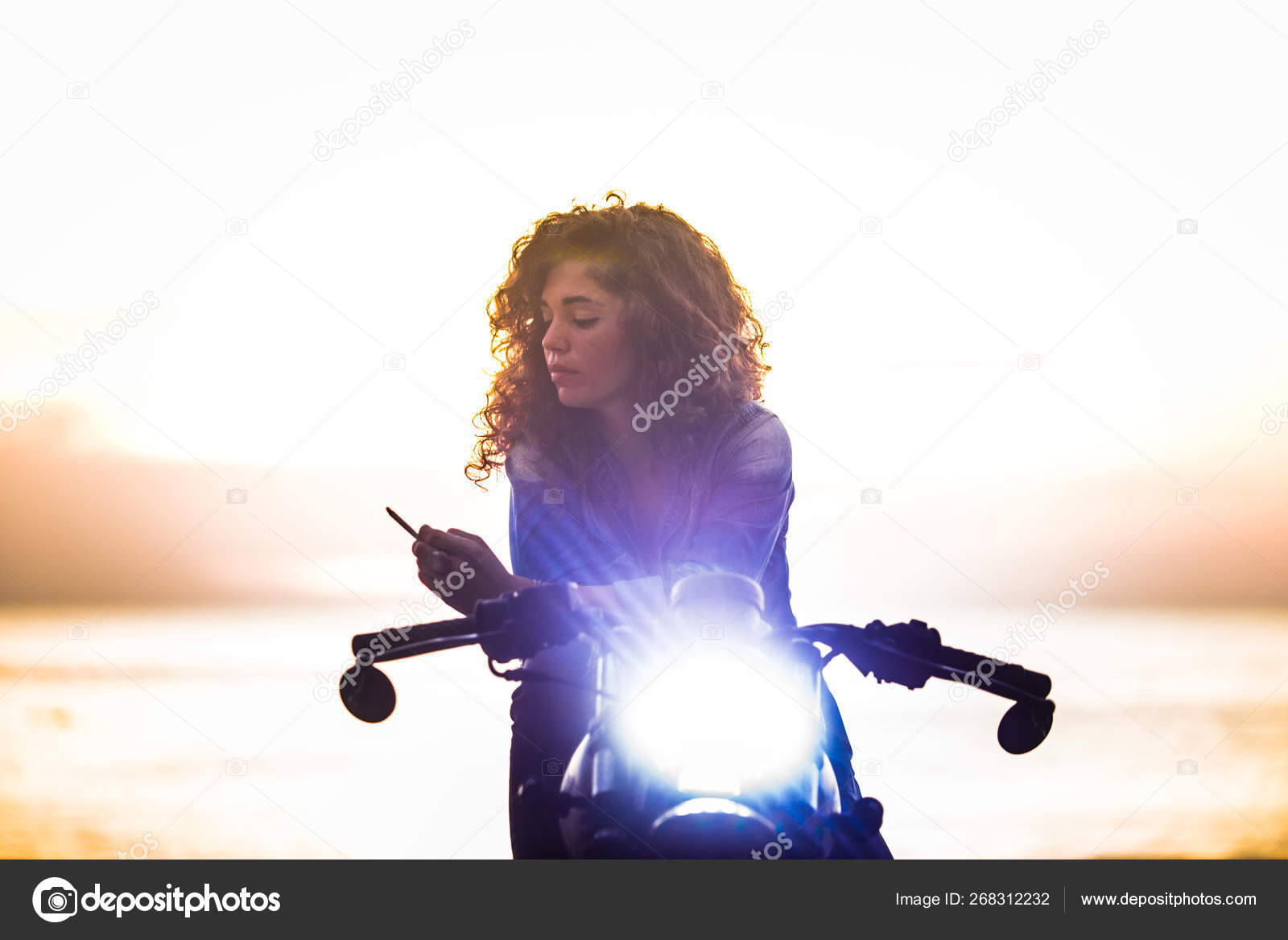 Female biker driving a cafe' racer motorbike — Stock Photo ...