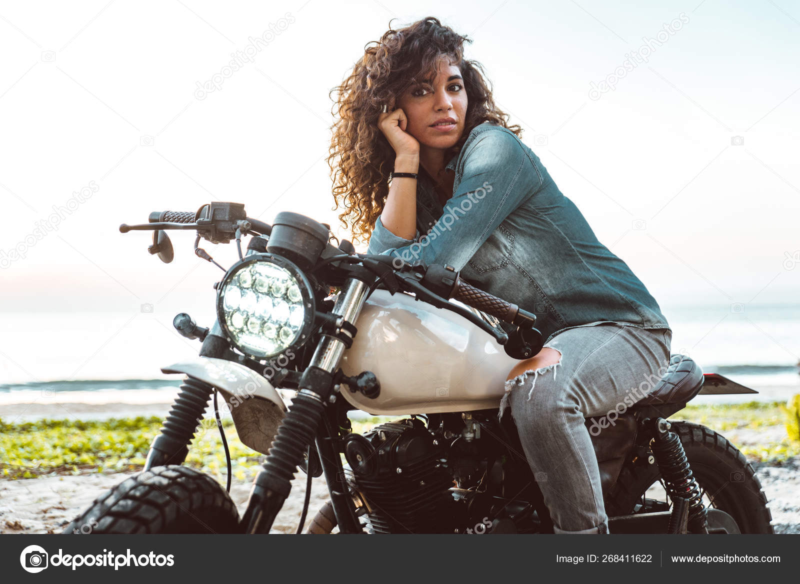 Female biker driving a cafe' racer motorbike — Stock Photo ...