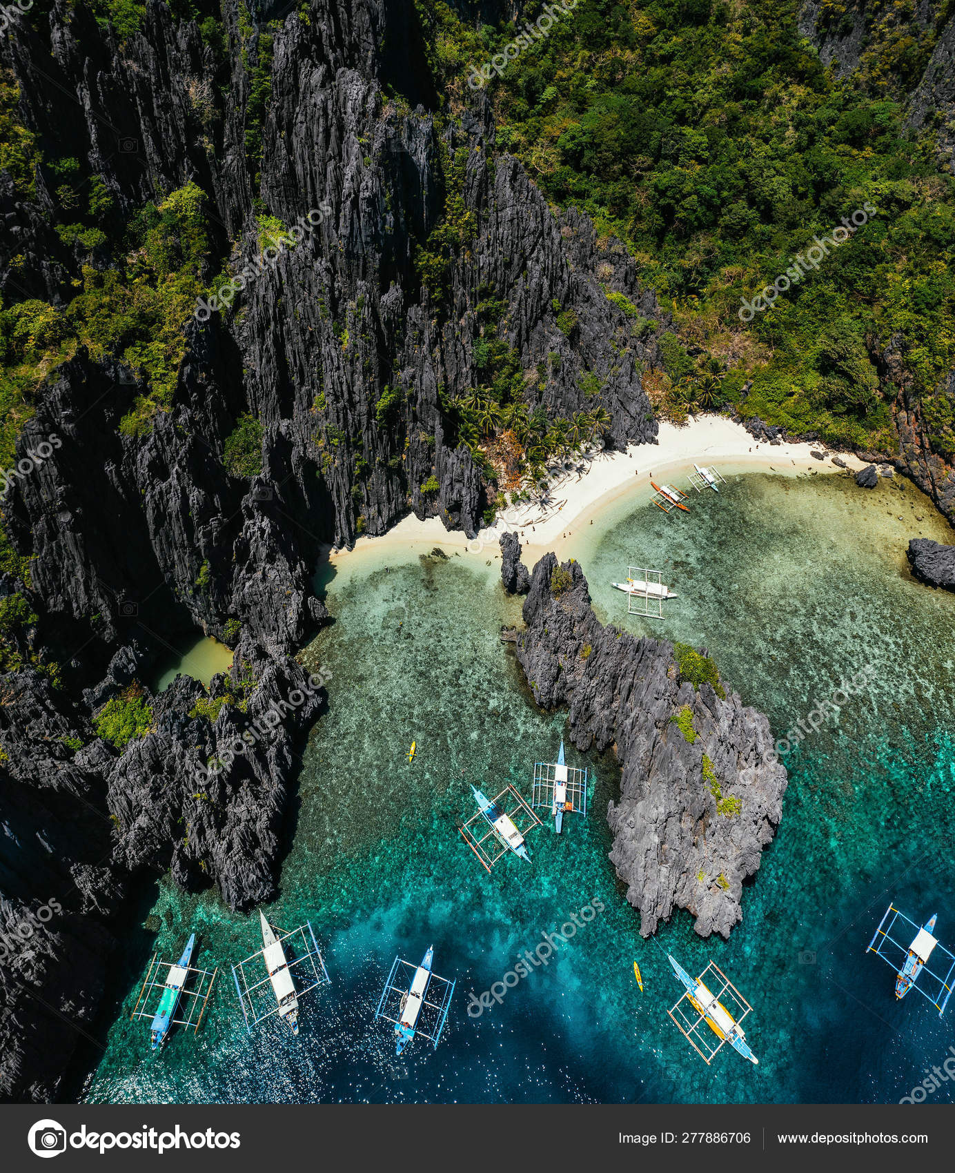 Small lagoon in El nido. People walking on the white sand, with — Stock ...