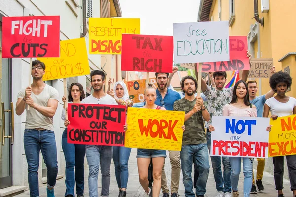 Activists demonstrating against social issues - Stock Image - Everypixel