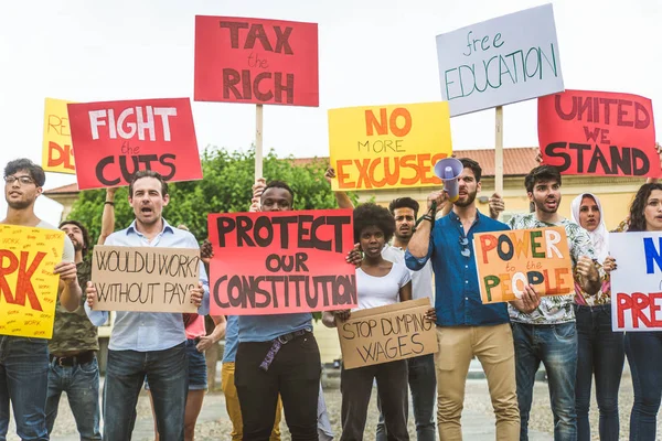 Activists demonstrating against social issues - Stock Image - Everypixel