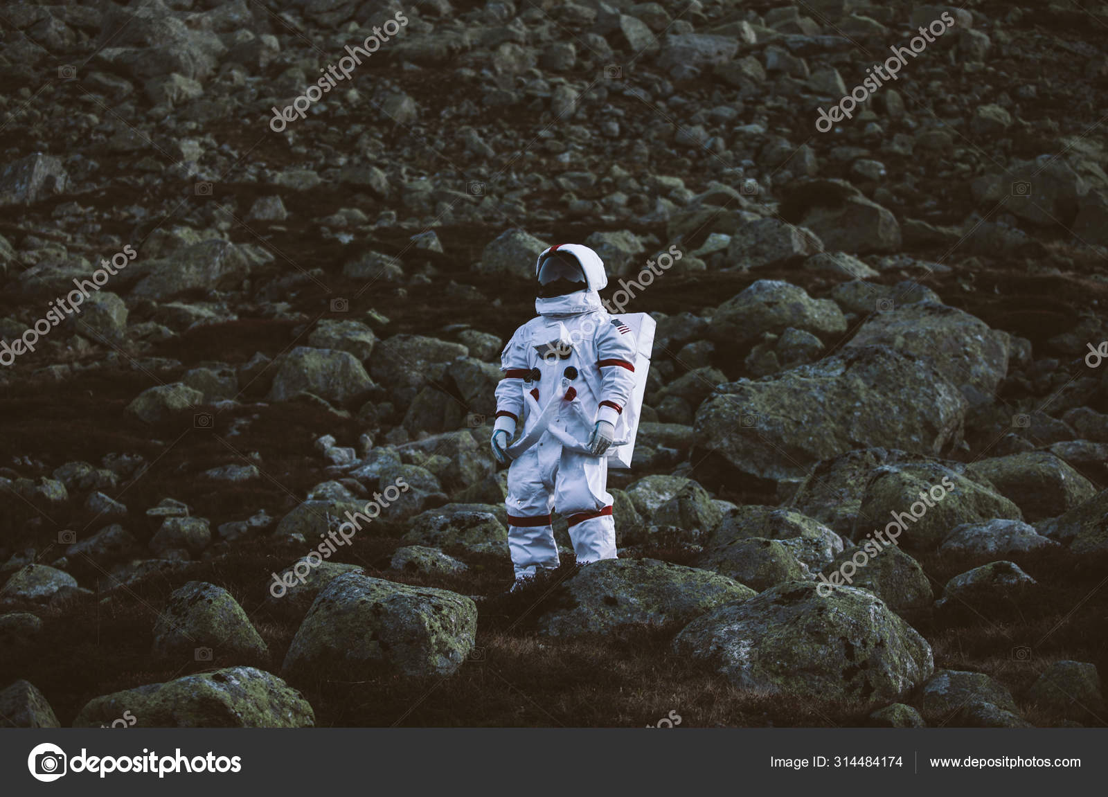 Astronaut exploring a new planet. Searching for a new home for h Stock ...