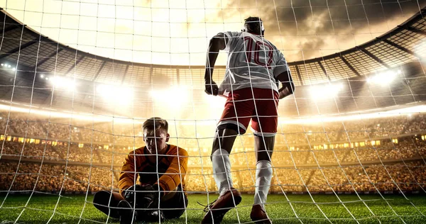 Intense soccer moment in front of the goal on the professional soccer ...