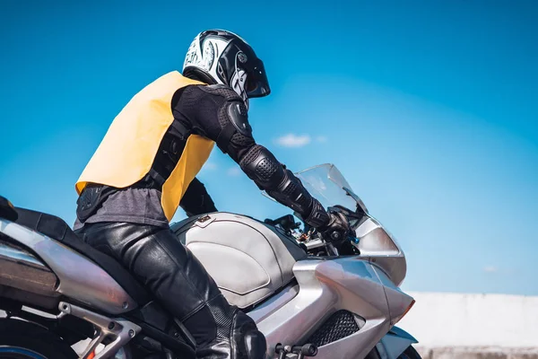 biker rides motorcycle, motorcyclist side view, close up of bike rides ...