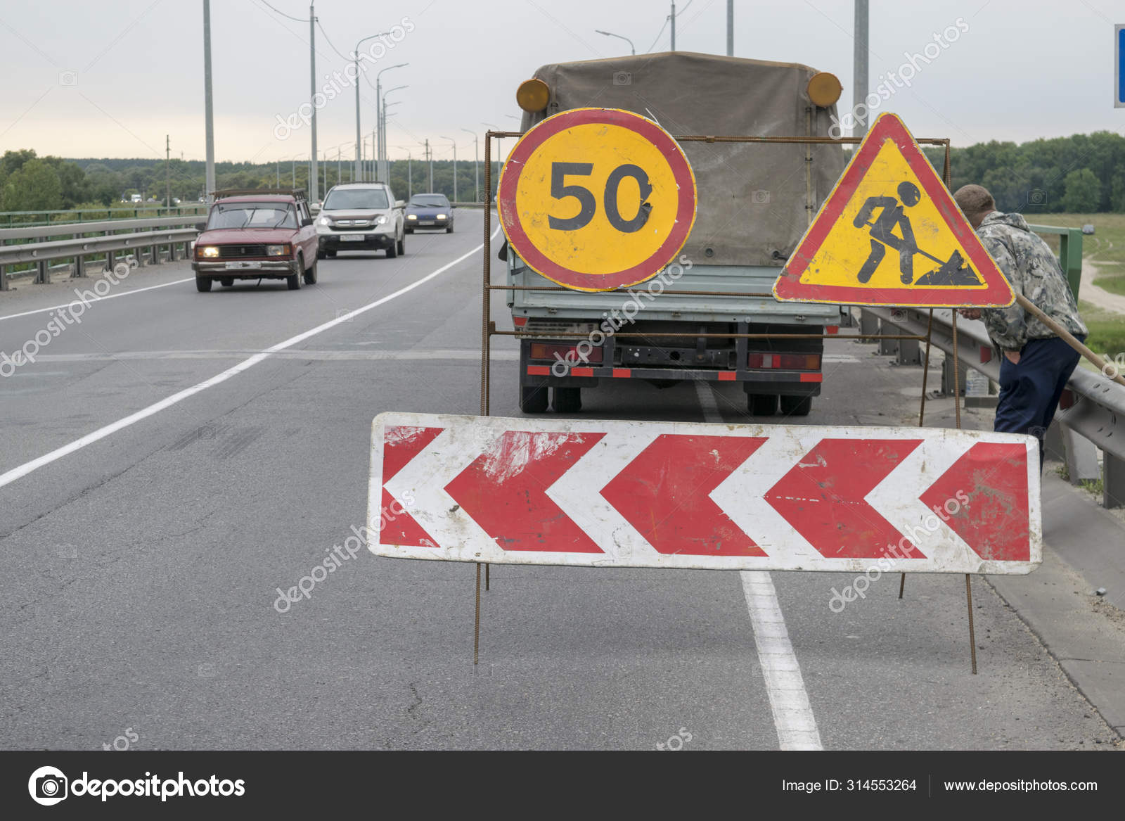 Road works are underway on the bridge over the river. For the safety of ...
