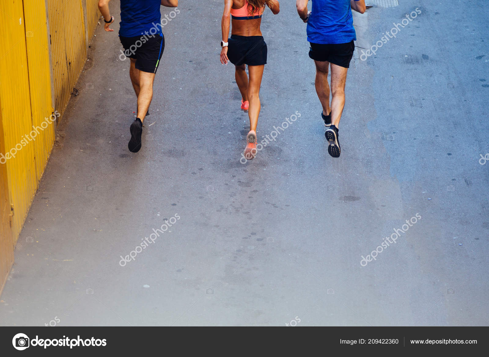 Rear View Three Professional Athletes Jogging Alleyway Garages — Stock ...
