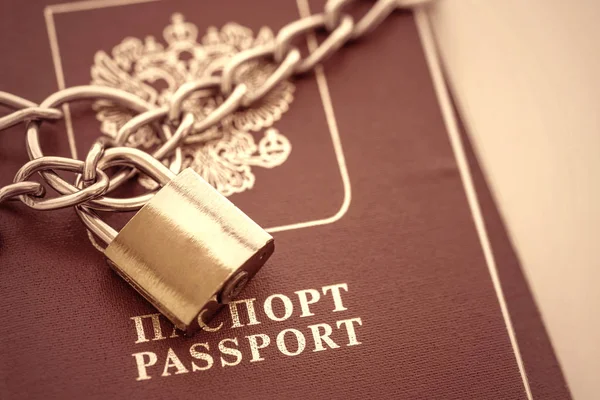 Russian Passports covered with a chain with a golden Lock. Toned ...