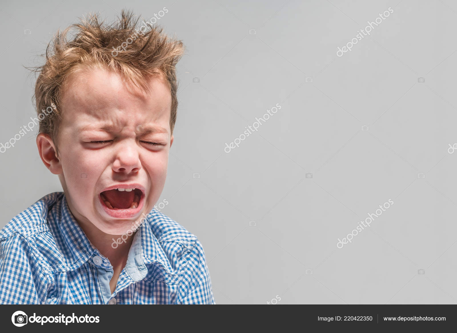 Crying Little Boy Gray Background Stock Photo by ©watman 220422350