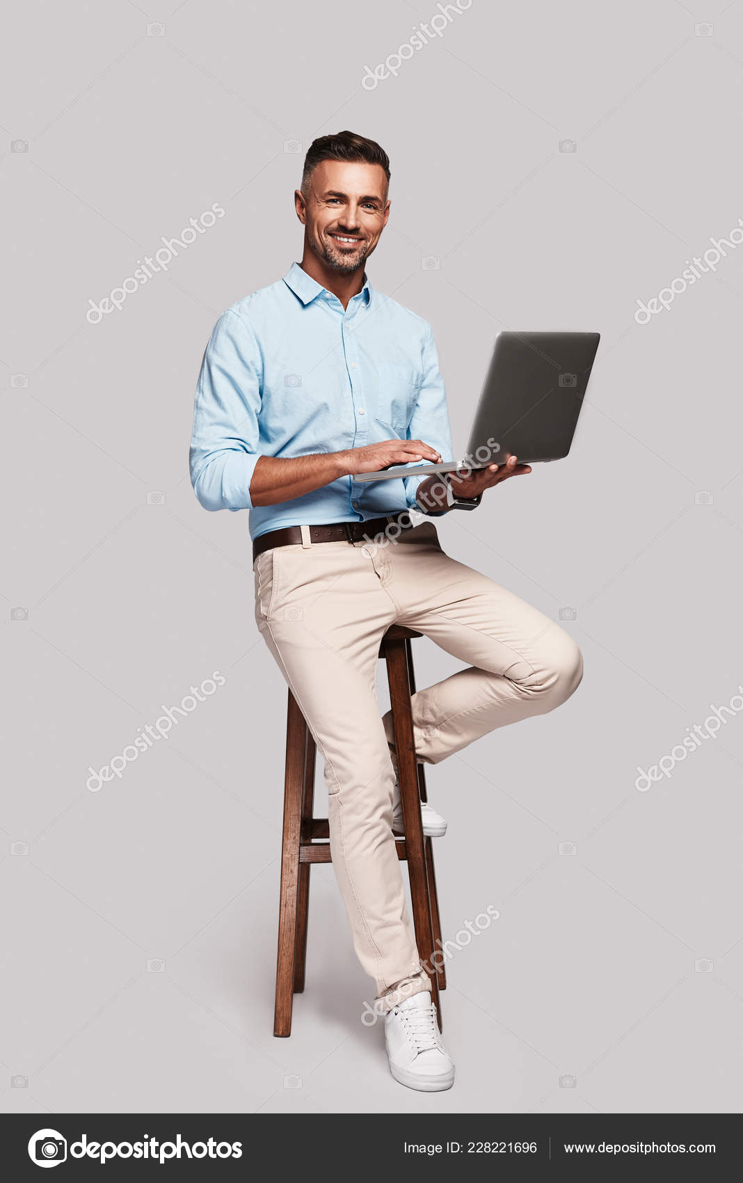 Smiling Good Looking Man Using Laptop Studio Sitting Chair Stock Photo ...