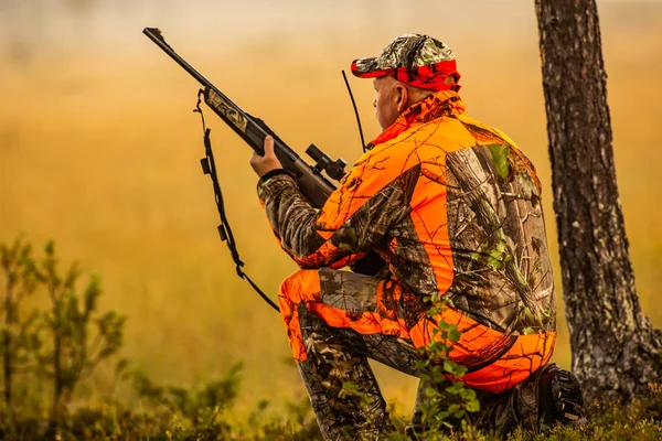 Hunter in the wilderness seeking prey - Stock Image - Everypixel