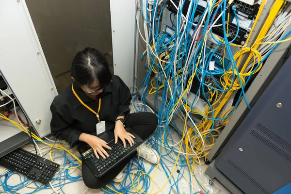 Minority woman working in a server room Stock Photos, Royalty Free ...