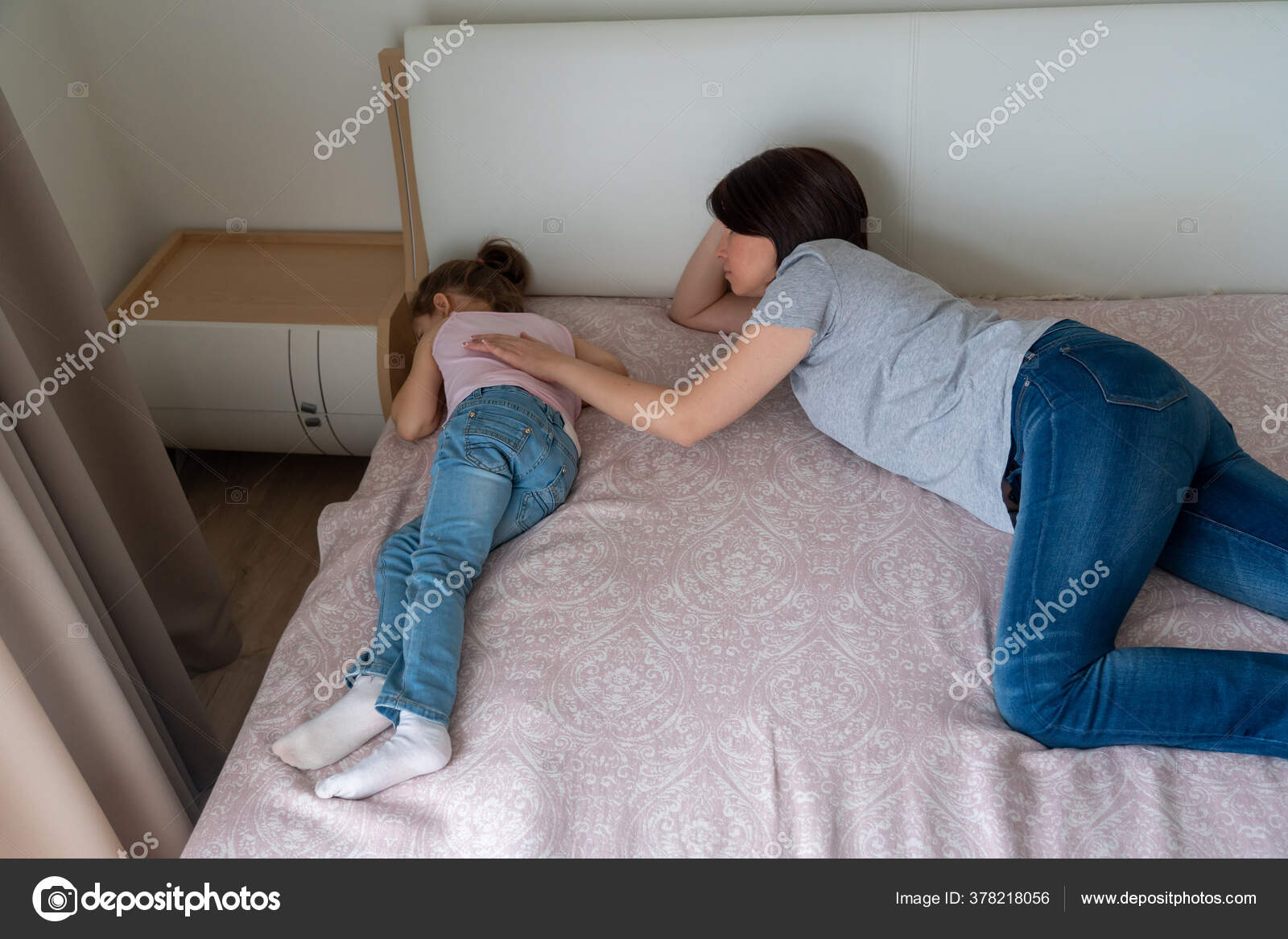 Loving young mother hugs upset little daughter, expressing support, young mum comforting ...