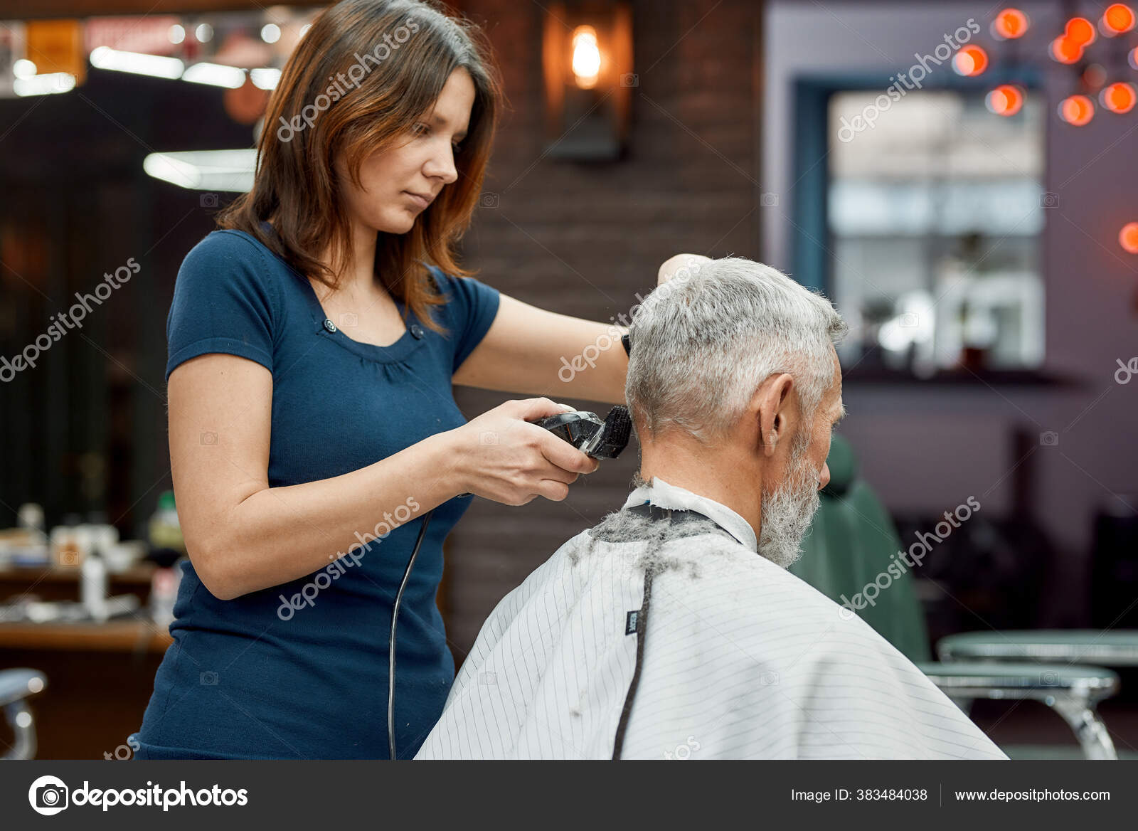 Girl Getting Haircut In Barber Shop