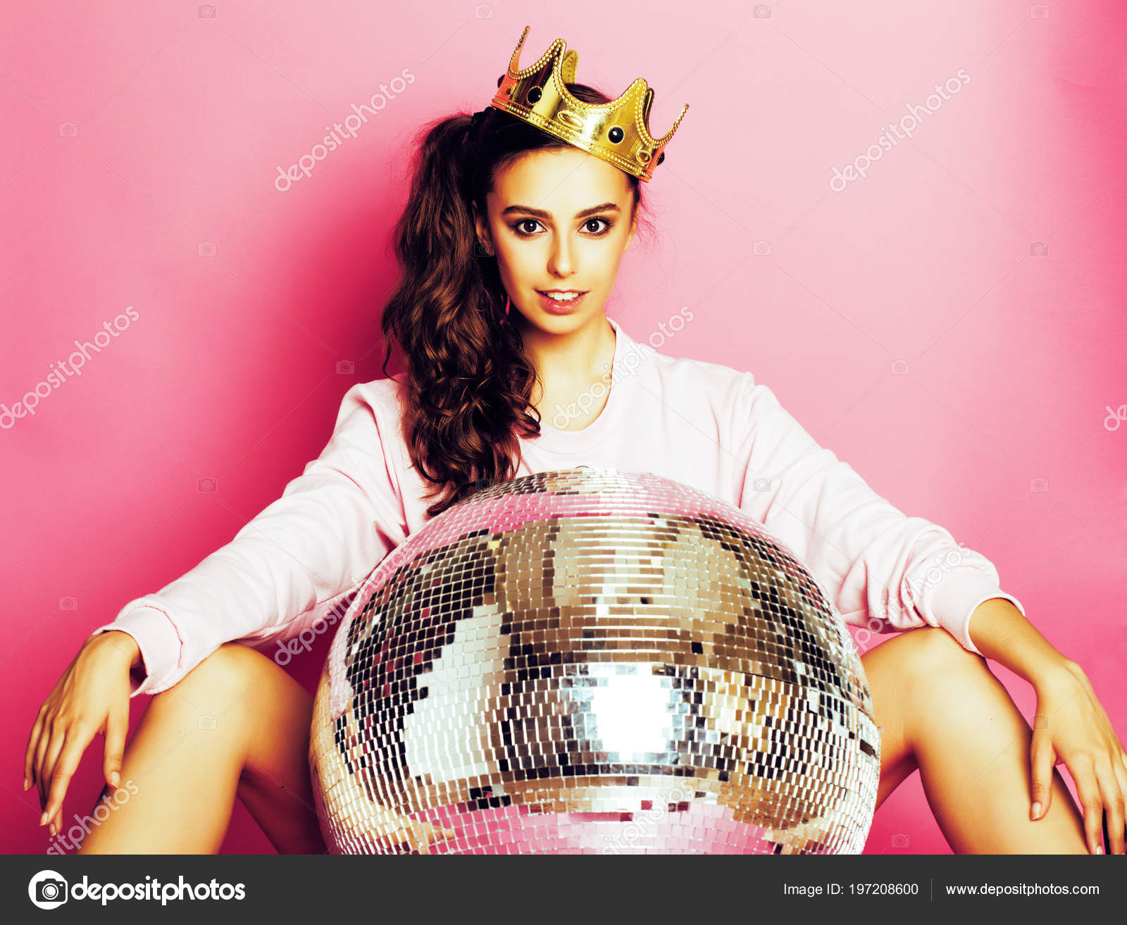 Young cute disco girl on pink background with disco ball and cro Stock ...