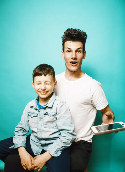 young pretty man model with little cute son playing together, li ...