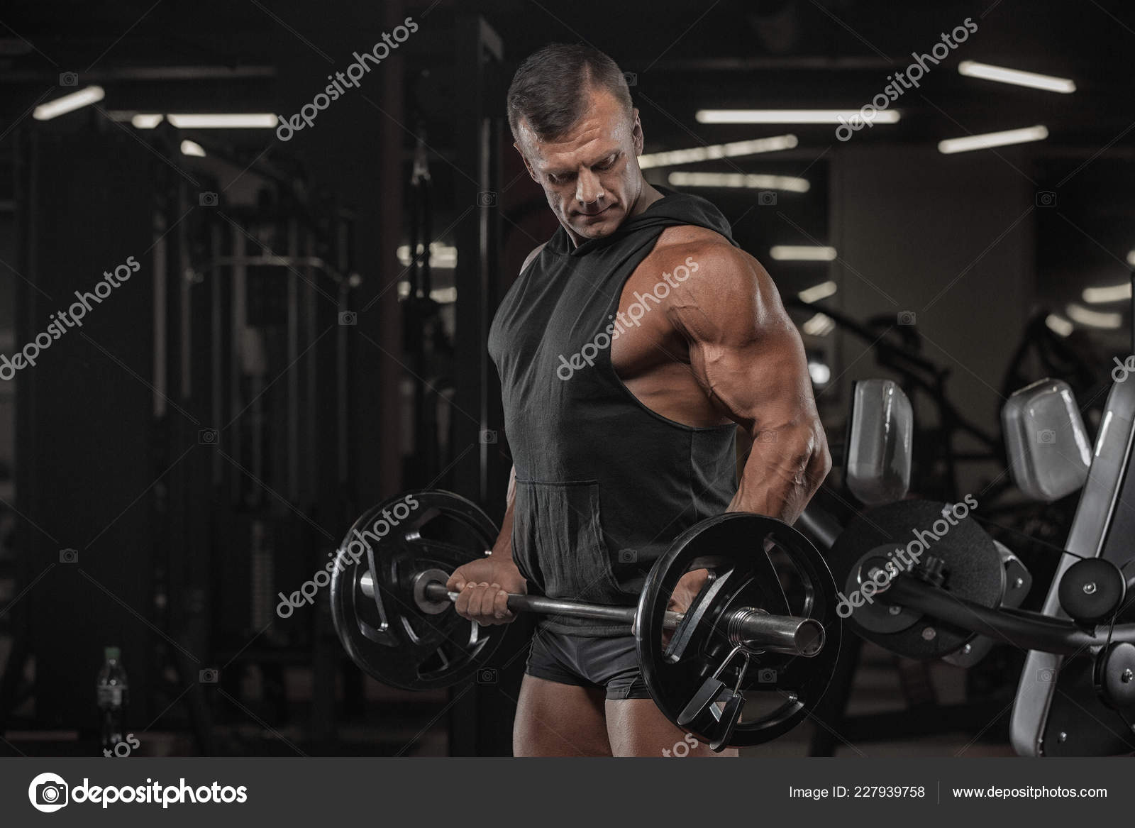 Handsome Man Big Muscles Trains Gym Exercises Stock Photo by ©roman.l ...