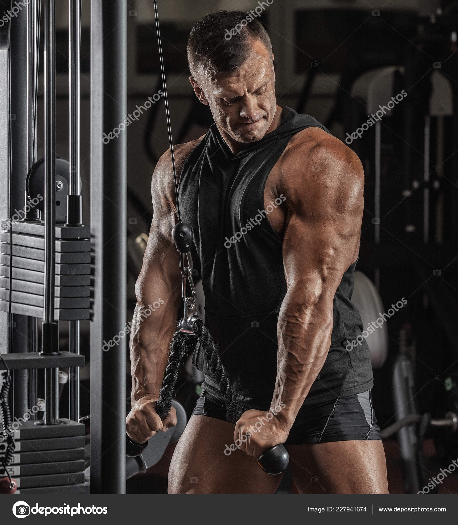 Handsome Man Big Muscles Trains Gym Exercises Stock Photo by ©roman.l ...