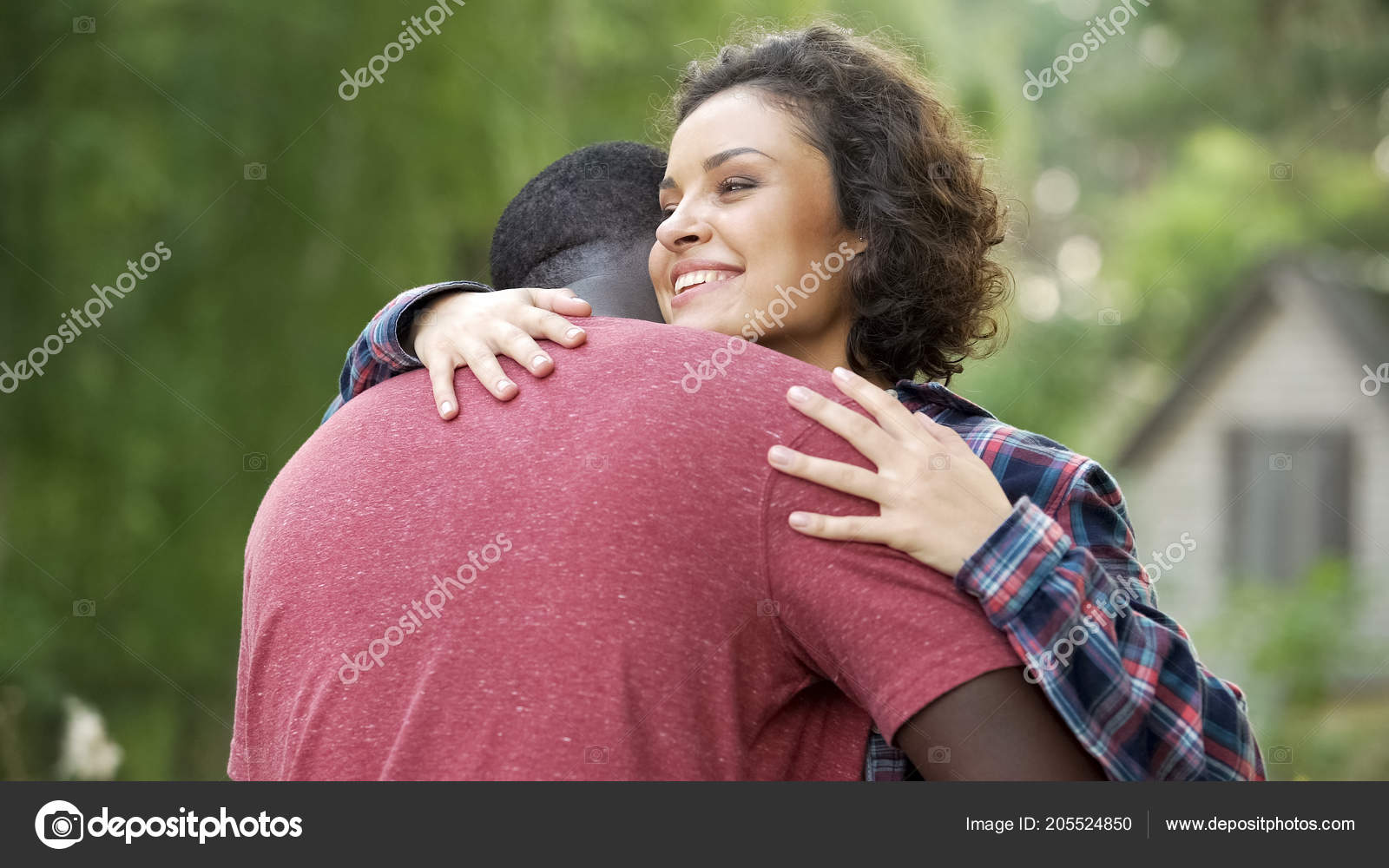 Supportive Wife Meeting Husband Front Home Giving Him Welcome Hug Stock ...