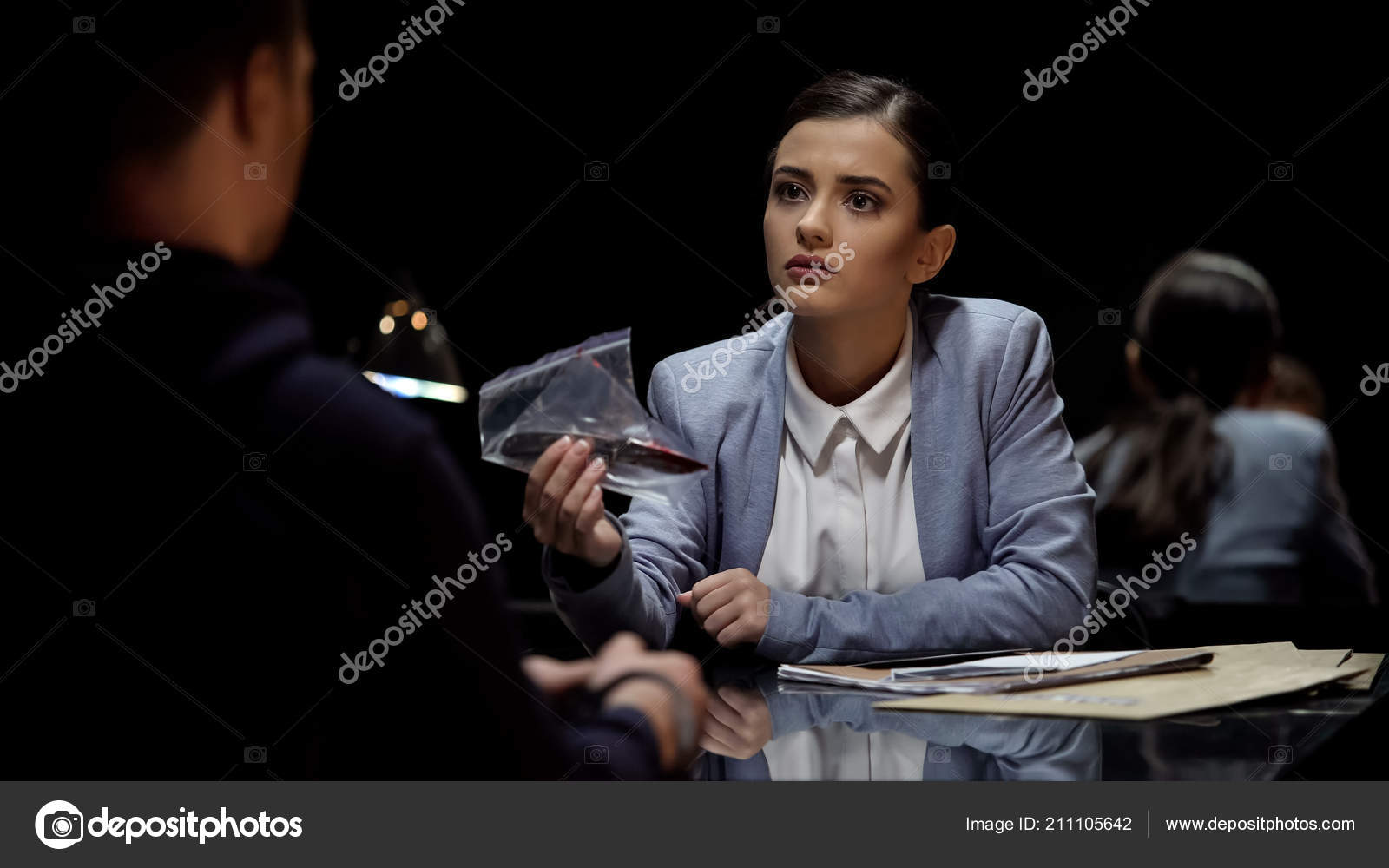 Attractive Lady Interrogator Demonstrating Bloody Knife Evidence ...