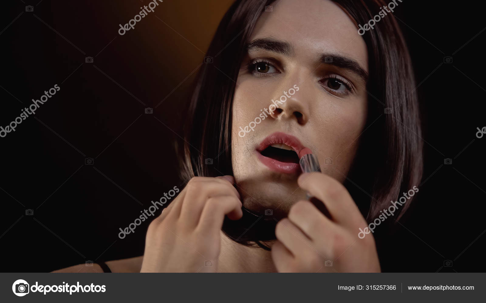 Beautiful Transgender Man Applying Lipstick Feels Comfortable Female ...